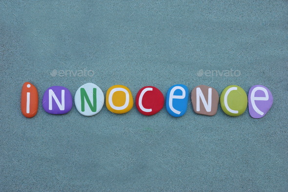 Innocence word composed with multi colored stone letters over green sand Stock Photo by ...